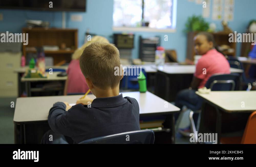 Grade school children in classroom for learning and education Stock ...