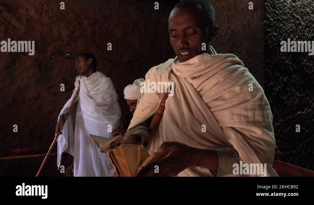 Ethiopian pilgrims pray from ancient Bibles in Lalibela church Stock ...