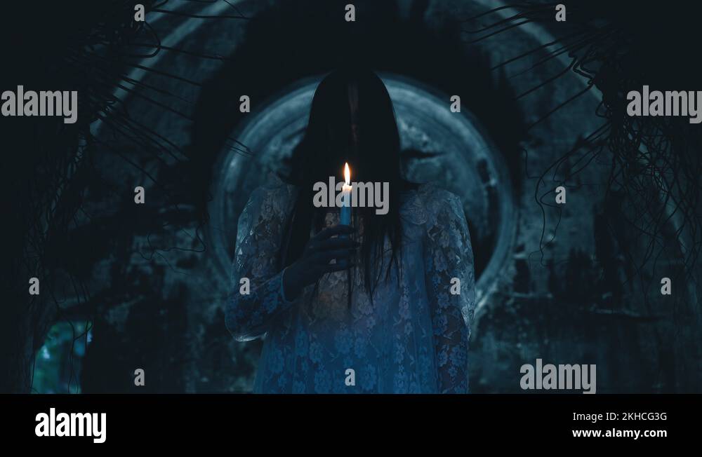 Witch holding candle in ancient crypt, working black magic, creating ...