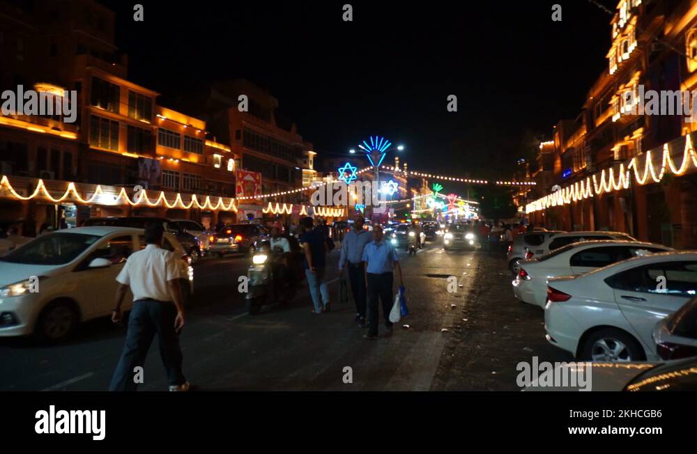 Rush hour traffic and people roaming around in the walled city of ...