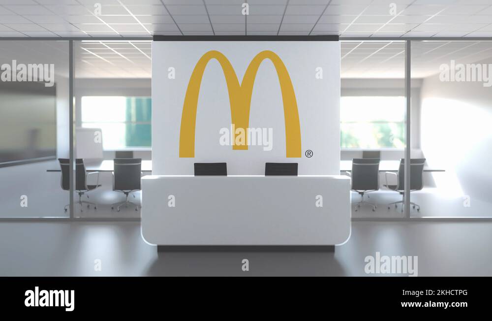 MCDONALD'S logo above reception desk in the modern office, editorial ...