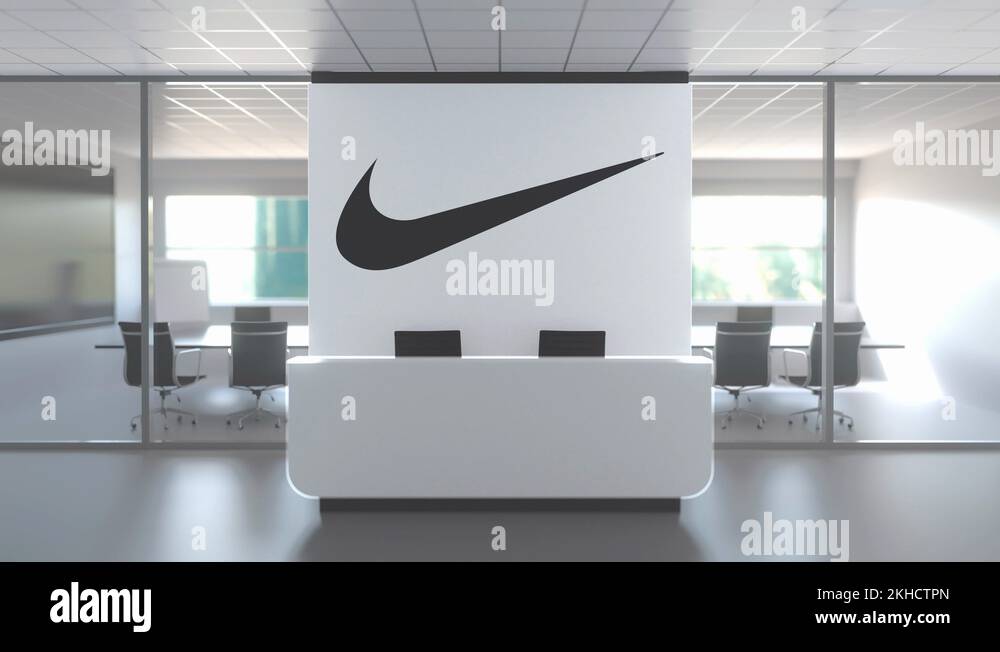 NIKE logo above reception desk in the modern office, editorial ...