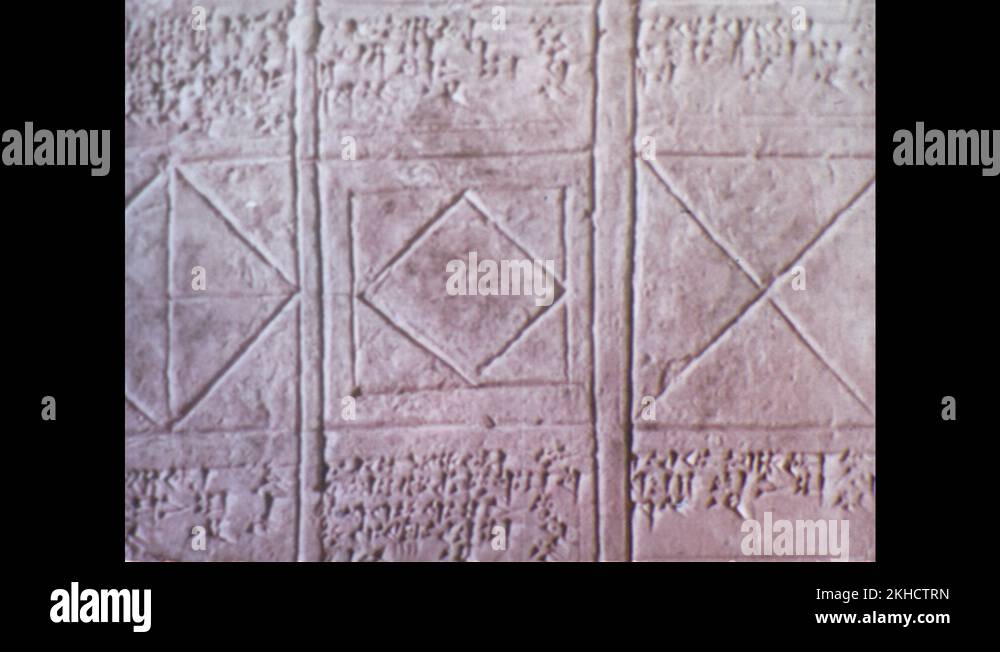 1950s: Hand holds Sumerian clay tablets, cuneiform writing, numbers ...