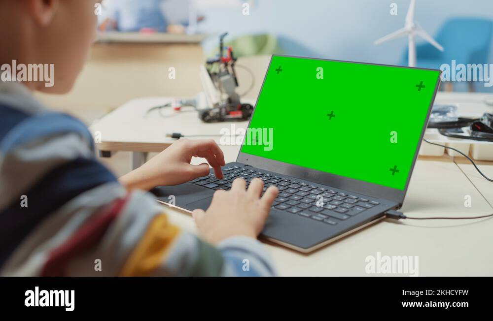 School Computer Classroom: View of a Kid Using Green Chroma Key Screen ...