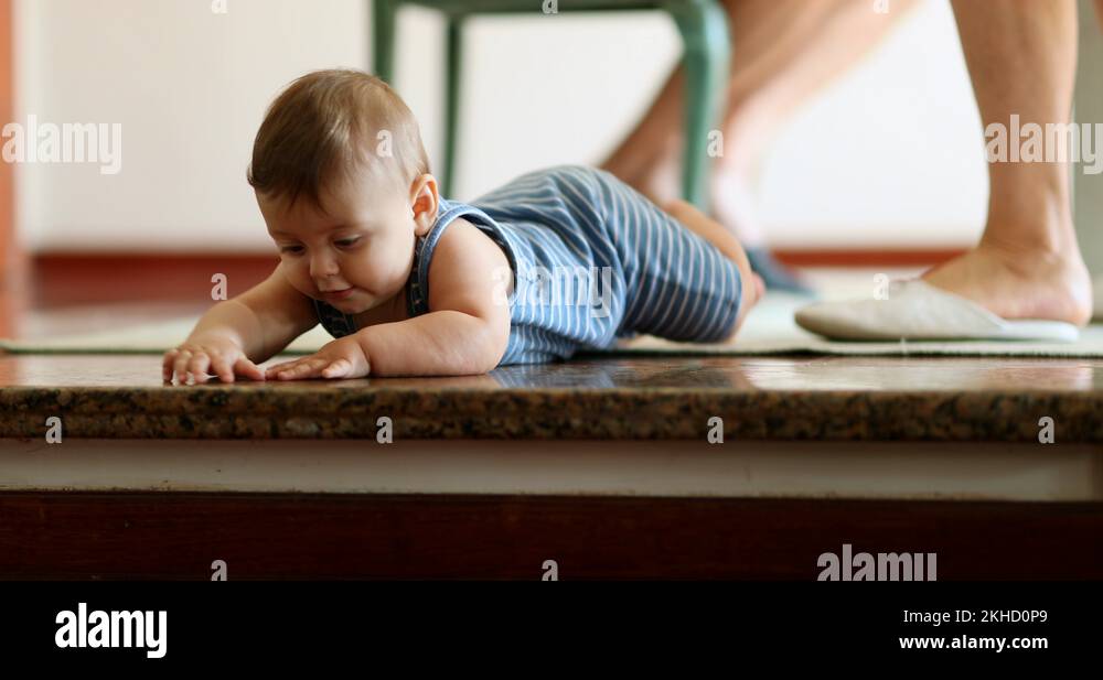 Baby boy infant crawling at home looking down at step stair Stock Video ...