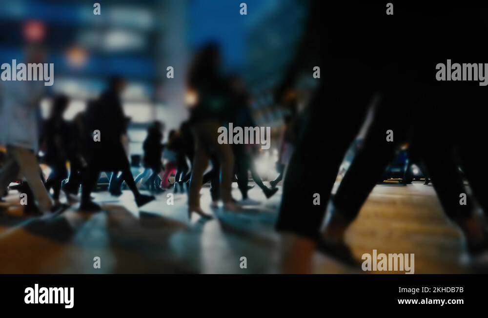 Crowd Of Pedestrians and shoppers Cross A Busy City Intersection At ...
