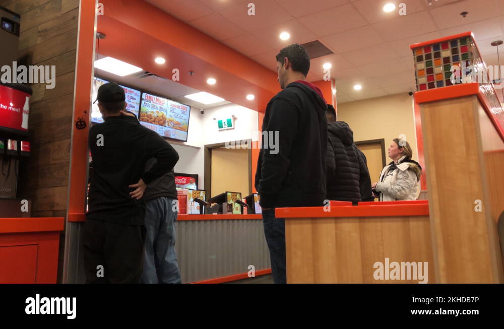 Motion of people line up for ordering food inside Popeyes chicken ...