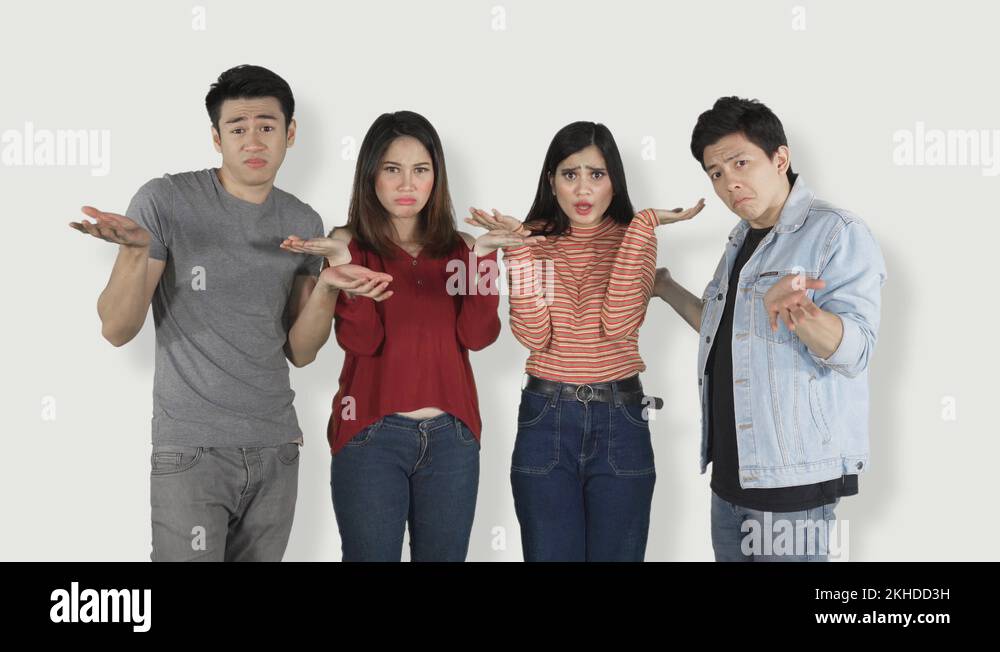 Confused young people shrugging their shoulders Stock Video Footage - Alamy