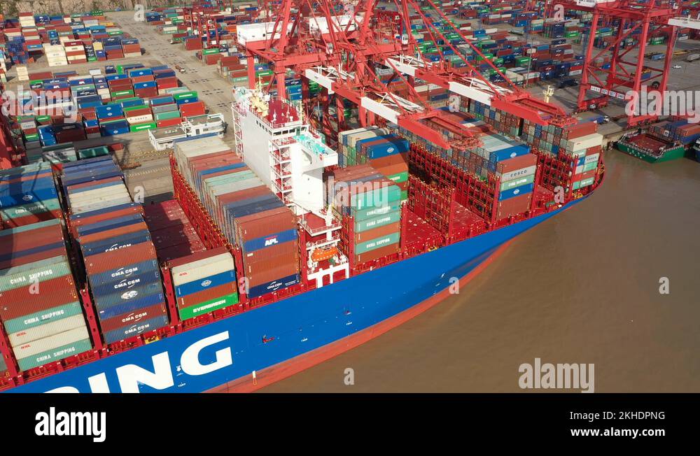 Drone shot cranes deck of cargo vessel in container terminal Port of ...