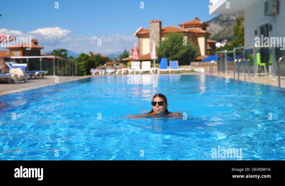 Sexy Girl In Black Swimsuit Relaxing In Pool Of Luxury Hotel Lady