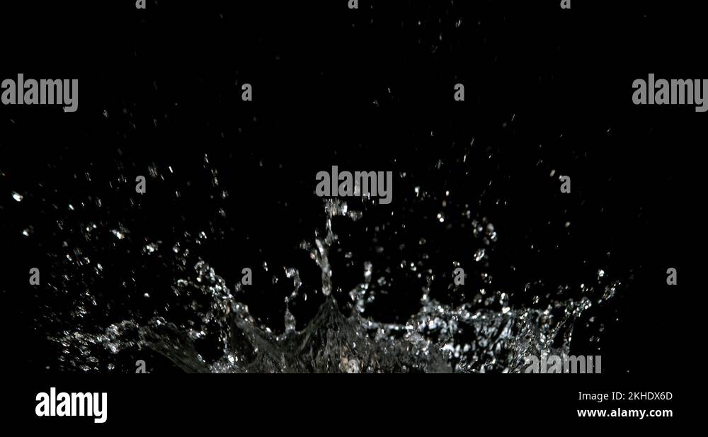 Water Exploding and Splashing against Black Background, Slow motion 4K ...