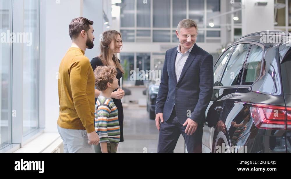 Successful Caucasian trader shaking hands of male adult customer and ...