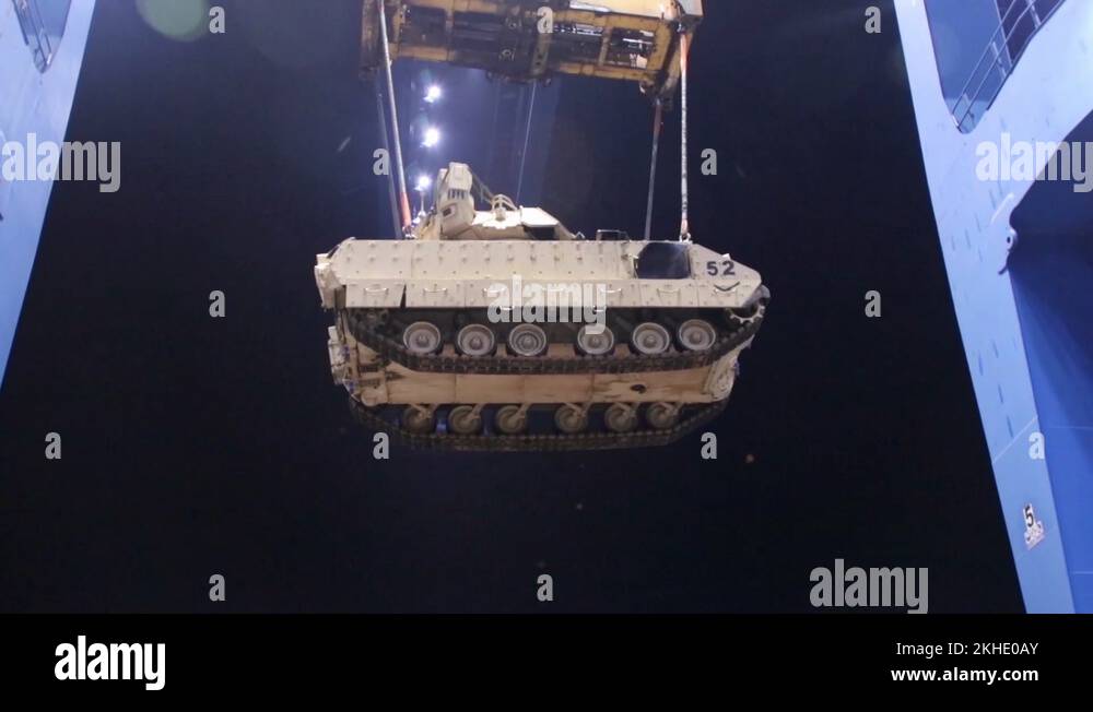 Overhead gantry crane transporting M2A3 Bradley Fighting Vehicle during ...