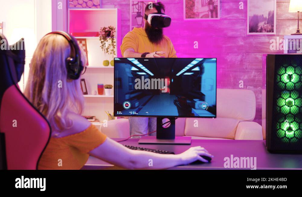 Beautiful gamer girl playing video game on powerful computer Stock ...