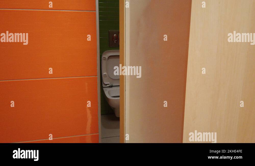 Point of view, first visitor perspective in a public restroom. Toilet ...