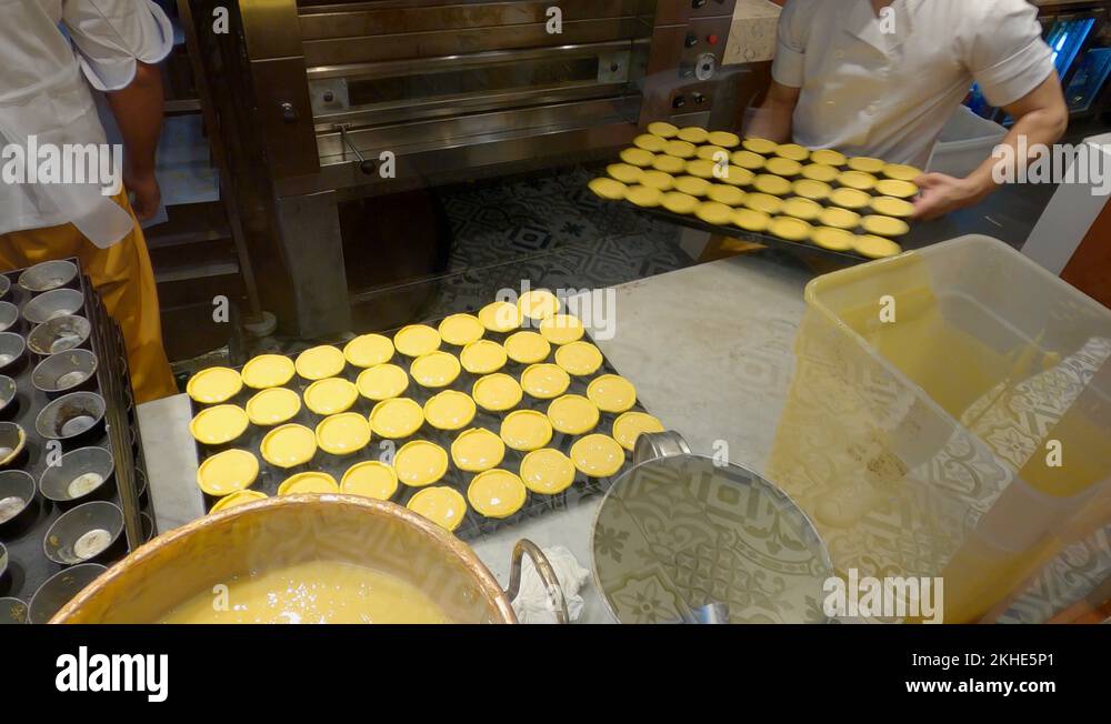 Bakery in Lisbon making the famous cream tarts called Pasteis de Nata ...