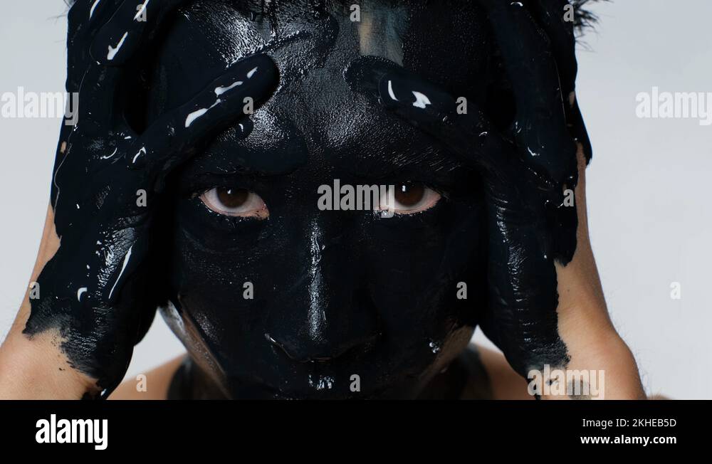 Asian face handsome man crazy mask close up looking at camera ...