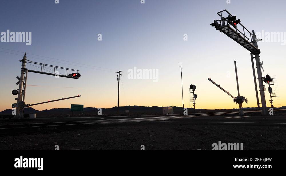 Railroad trains passing desert highway crossing 4K Stock Video Footage ...