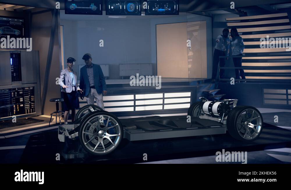 Female Engineer shows Electric Car Design Features to Client Stock ...