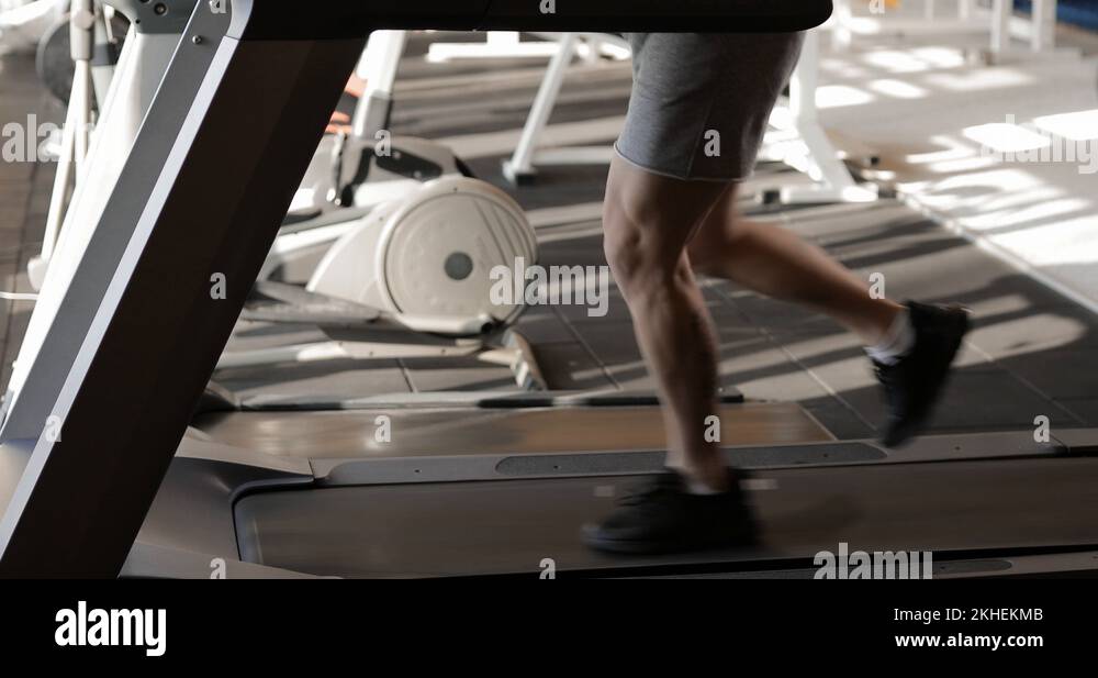 Man running on a treadmill in gym Stock Video Footage - Alamy