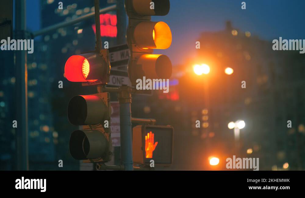 Traffic light on night street intersection change signals from red 2 ...