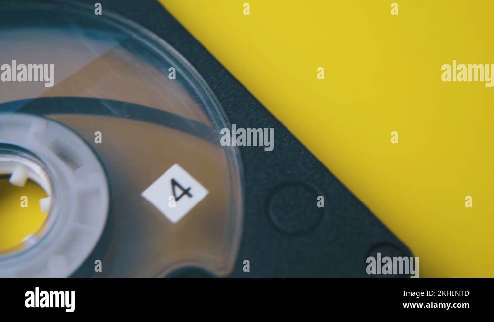 old compact cassette with number four on yellow background Stock Video ...