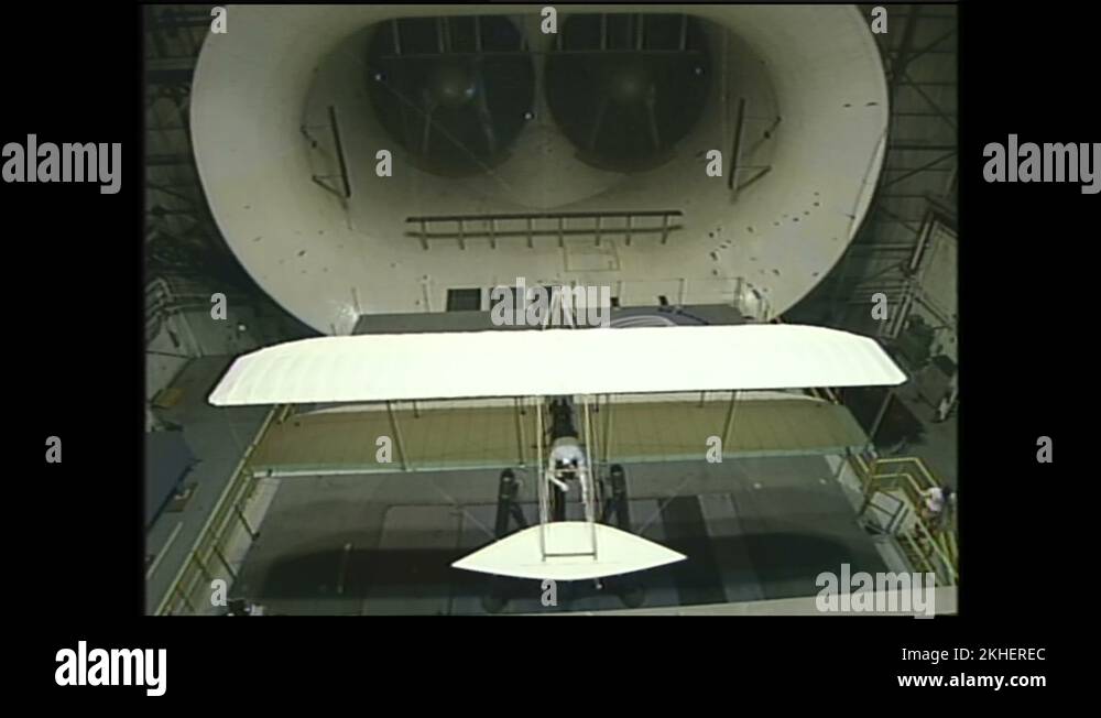 1990s: Replica of Wright Bros' airplane in wind tunnel, with dummy ...