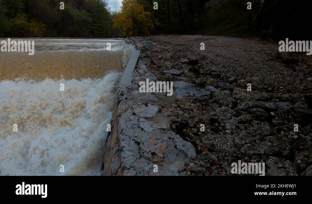 Slow motion left pan water flooding on man made river cascades Stock ...