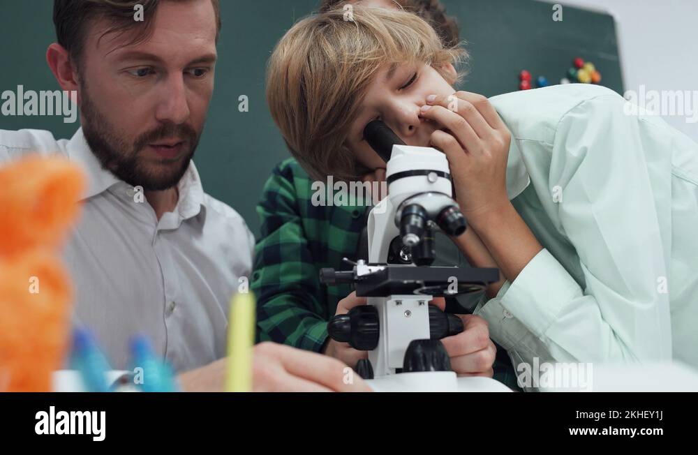 lesson in a modern school, a teacher and children's look into a ...