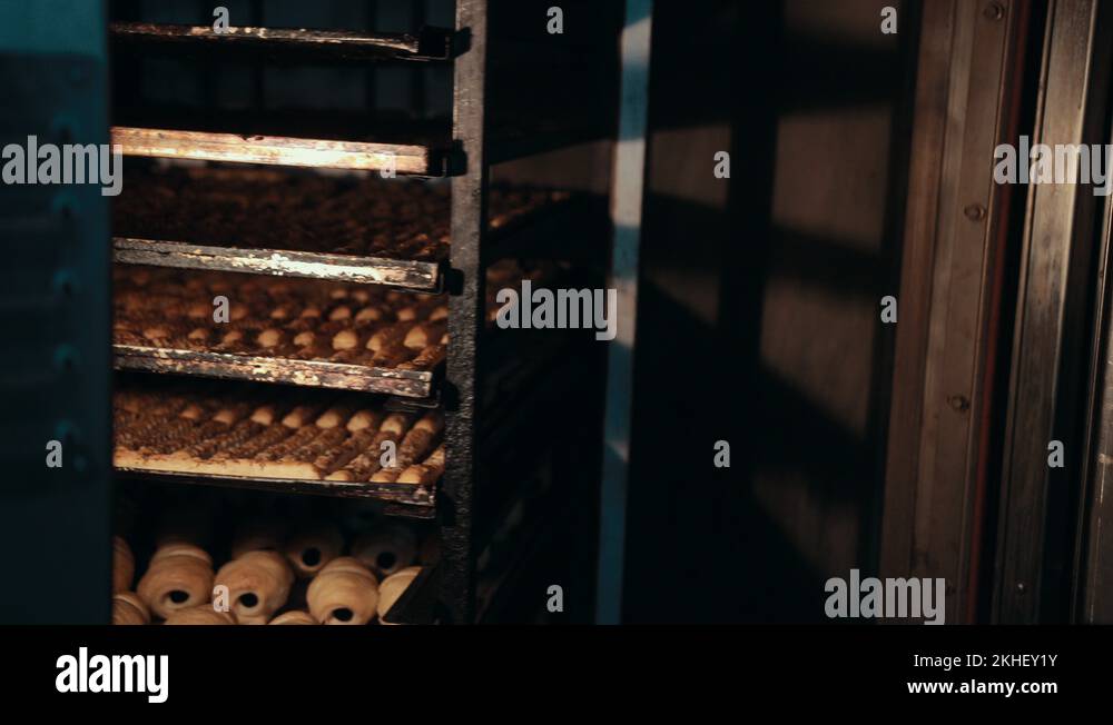 Different types of pastry are moving inside hot bakehouse oven Stock ...