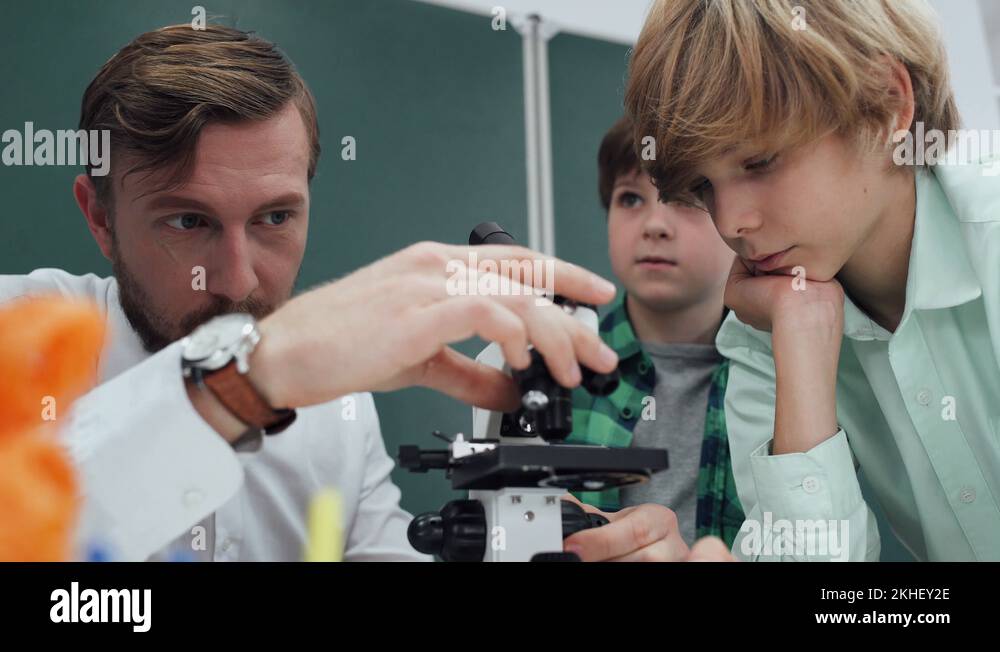 lesson in a modern school, a teacher and children's look into a ...