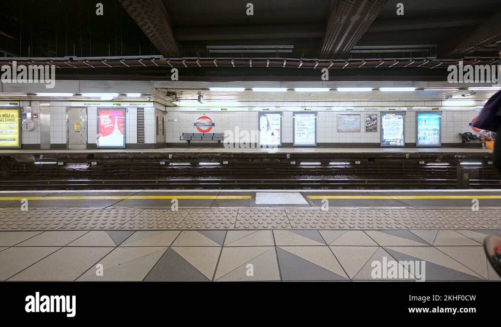 People walking on the platform at Monument Underground Station, London ...