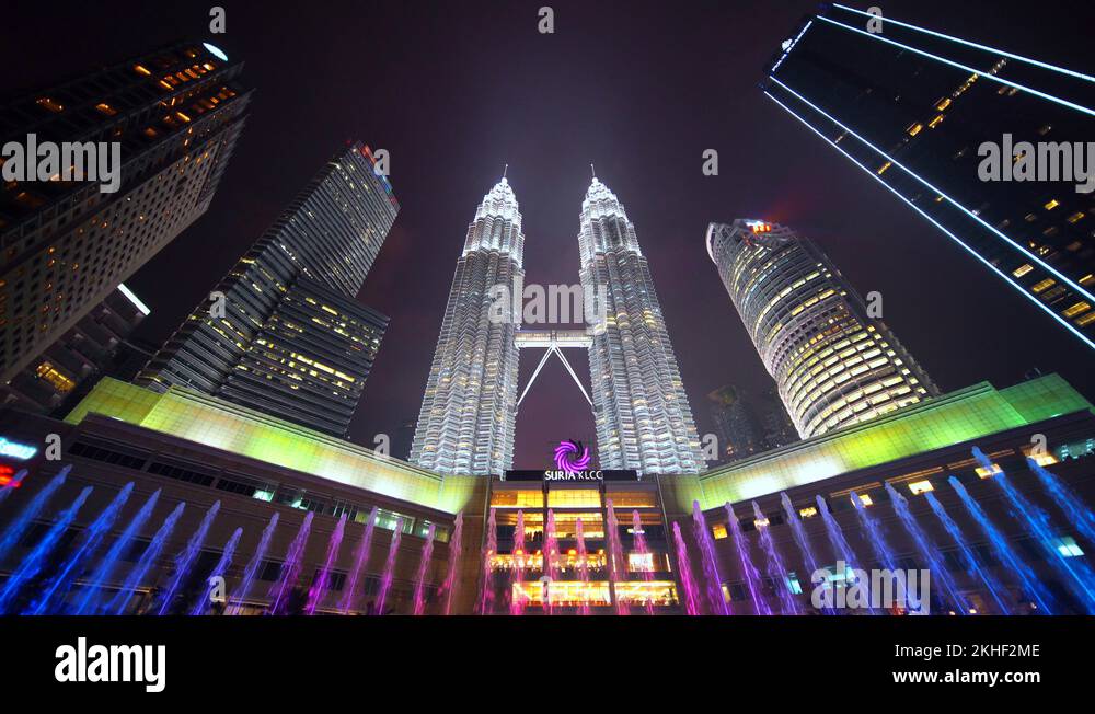 Suria KLCC and Petronas Twin Towers at night Stock Video Footage - Alamy