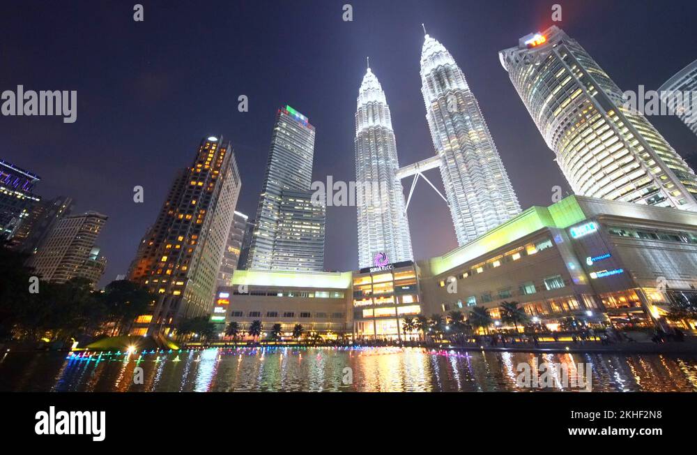 Suria KLCC and Petronas Twin Towers at night Stock Video Footage - Alamy