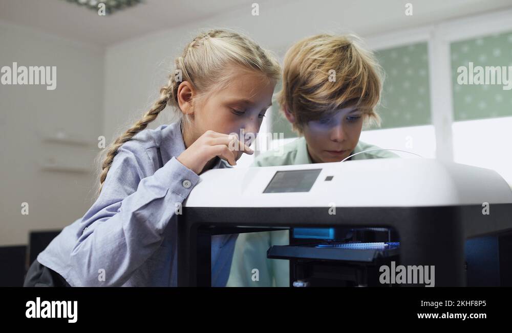 Education in the modern school, children learn modeling, boy and girl ...