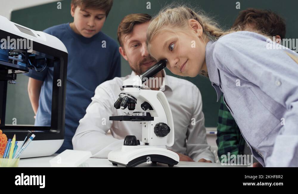 lesson in a modern school, a teacher and children's look into a ...