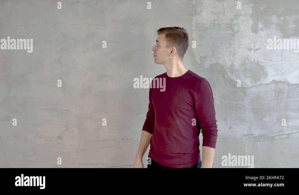 young man shows a presentation points his hand to 4 positions on the ...
