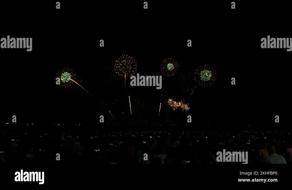 Real fireworks background and people who come to watch on the beach ...