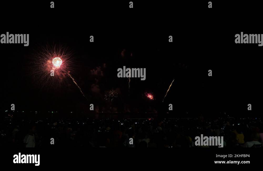 Real fireworks background and people who come to watch on the beach ...