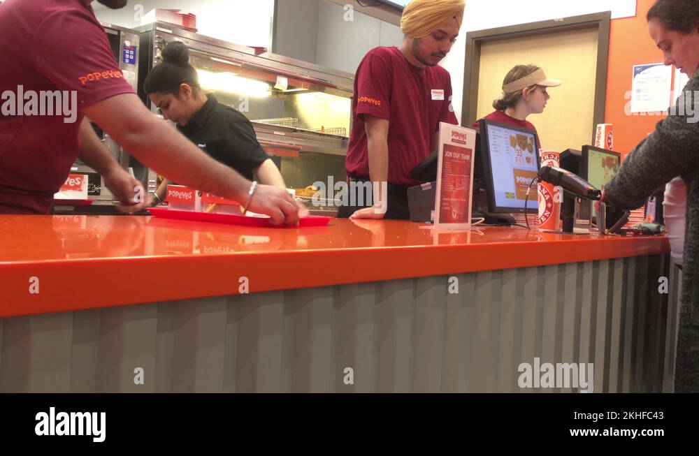 Motion of people line up for ordering food inside Popeyes chicken ...