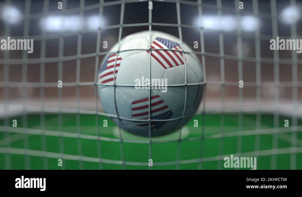 Football with flags of the United States hits goal net. Slow motion 3D ...