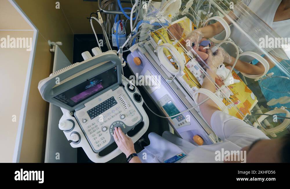 A baby in the incubator in undergoing an ultrasonic scan Stock Video ...
