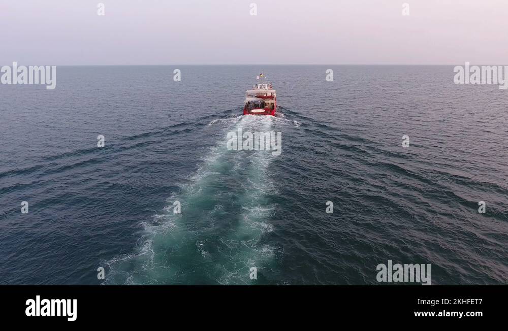 Top view flight behind a ship sailing on the open sea. Catamaran ...