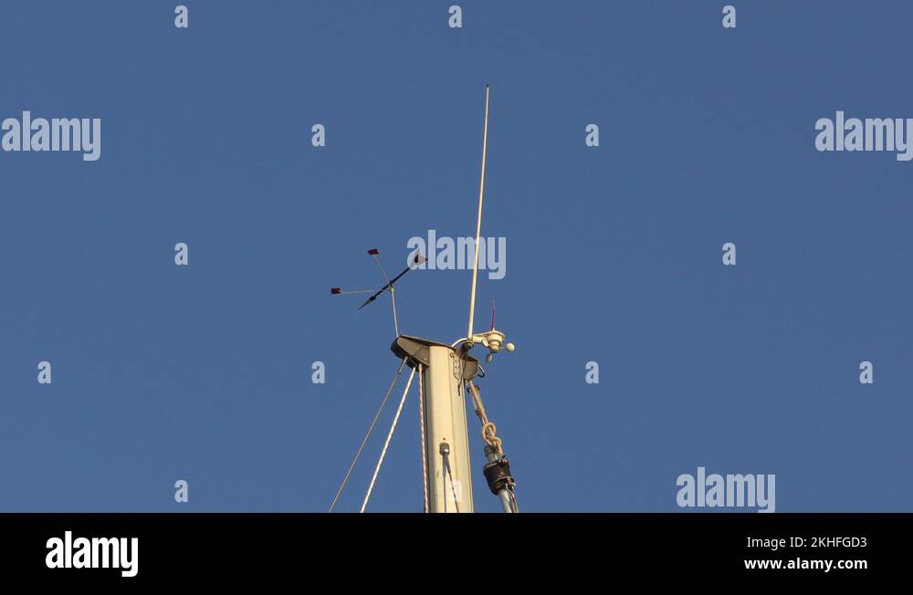 Mast of marine sailing yacht with communication antenna, and navigation ...