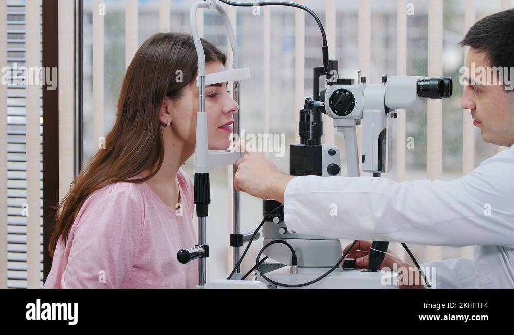 Ophthalmology treatment - young pretty smiling woman checking her ...