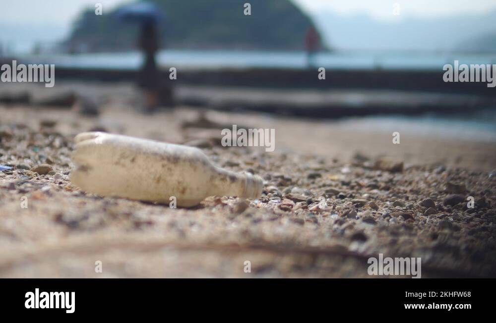 Plastic Bottle Washed Up On Beach, Polluted Dirty Ocean Stock Video ...