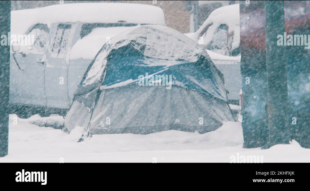 Homeless tent in snowstorm showing urban poverty in cold Stock Video ...