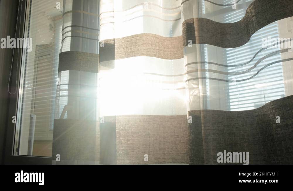 Curtains on the window sunlight through the curtains in the morning, a ...