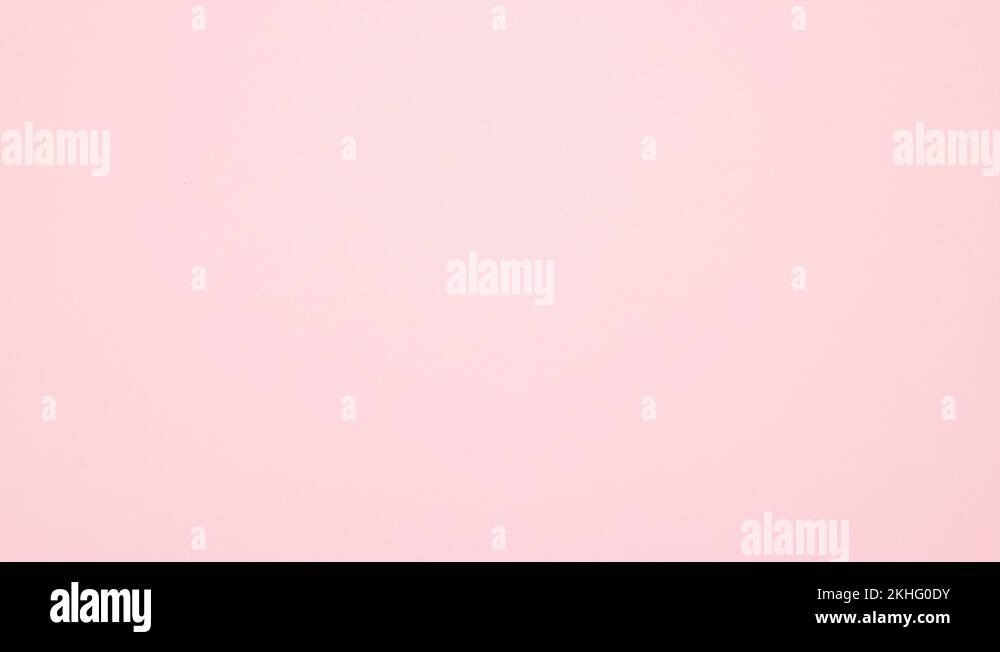 Pink birthday decoration appear and disappear from pink background ...