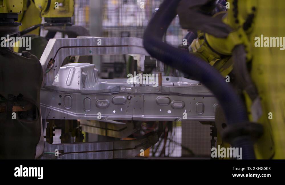 Automated robots at work inside an automobile manufacturing plant Stock ...